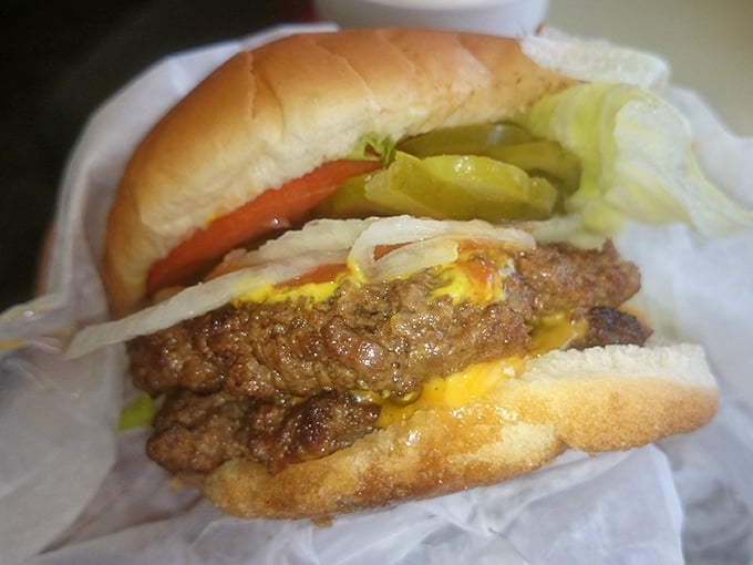 The cheeseburger that launched a thousand road trips. Notice how the pickles and onions aren't hiding&mdash;they're proud supporting actors in this meaty drama. 