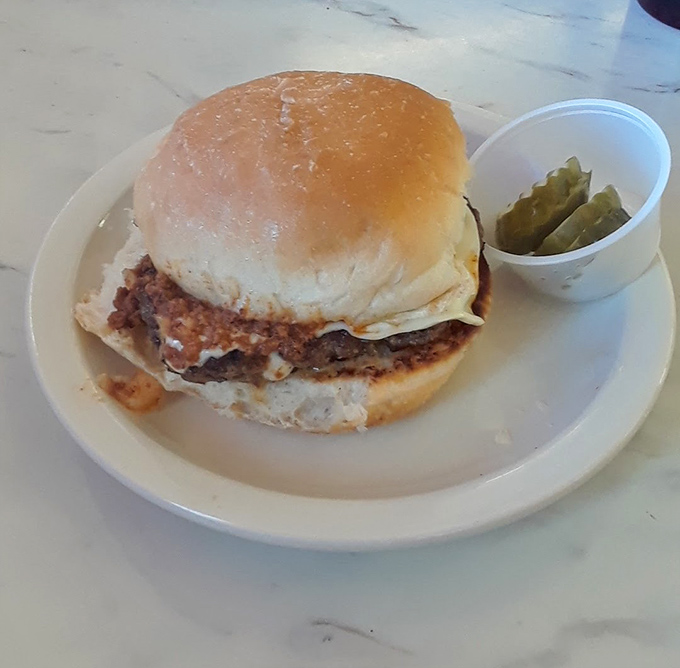 This isn't just a cheeseburger&mdash;it's edible architecture with a foundation of beef and a melty cheese roof.