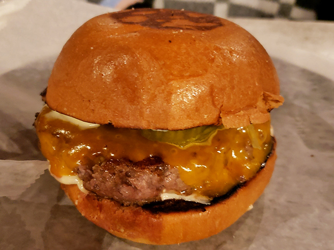 The humble cheeseburger, elevated to art form. That melty cheese cascade isn't an accident—it's edible architecture designed for maximum pleasure.