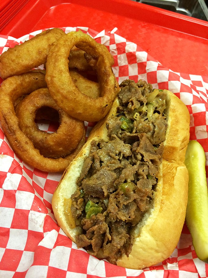 A proper cheesesteak with golden onion rings that would make even a Philadelphian nod in approval. The pickle stands guard.