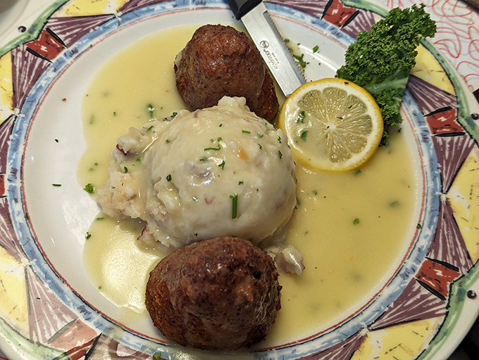 Comfort food elevated to art form&mdash;tender chicken nestled in lemony sauce with perfectly formed meatballs standing guard on the perimeter.
