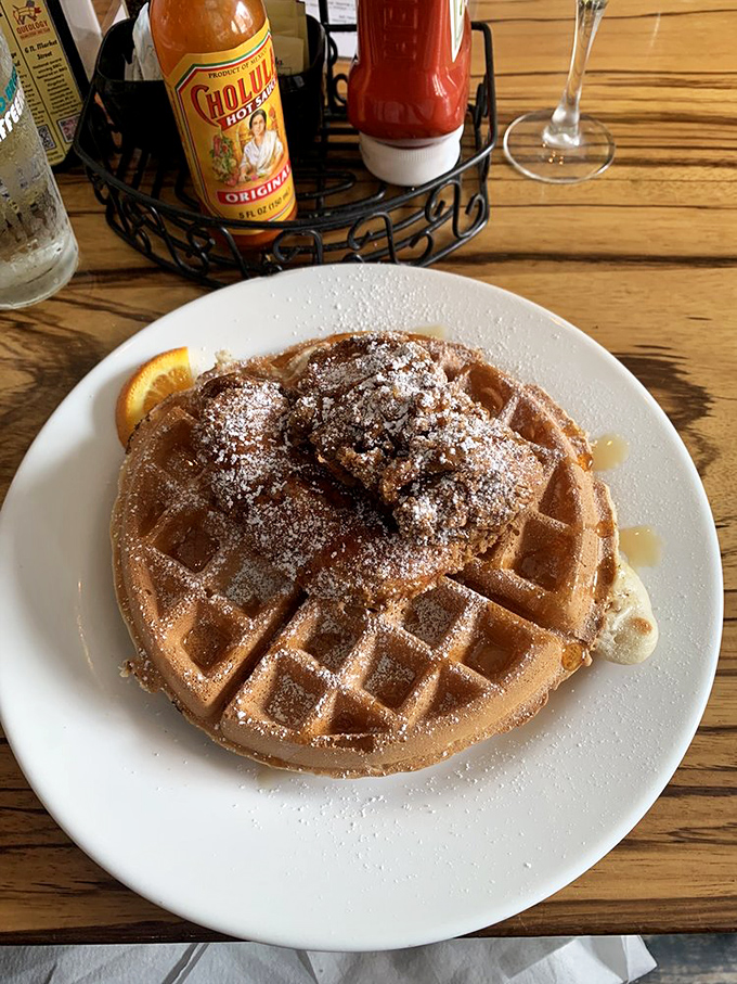 This Belgian waffle topped with powdered sugar and syrup is the breakfast equivalent of finding an extra $20 in your pocket &ndash; an unexpected joy.
