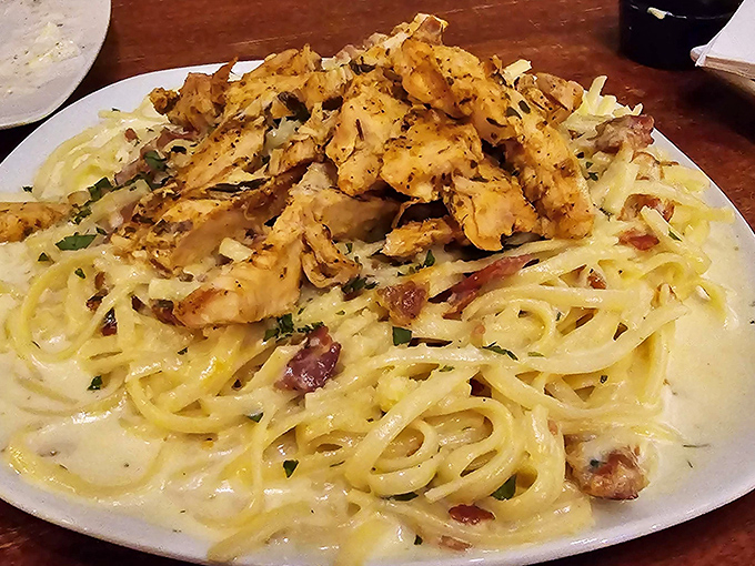 Creamy carbonara that would make an Italian grandmother nod in approval, topped with perfectly seasoned chicken that takes this pasta from excellent to extraordinary.