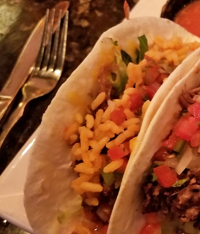 Soft tortillas cradle a colorful medley of fillings, proving that sometimes the simplest presentations deliver the most satisfying flavors.