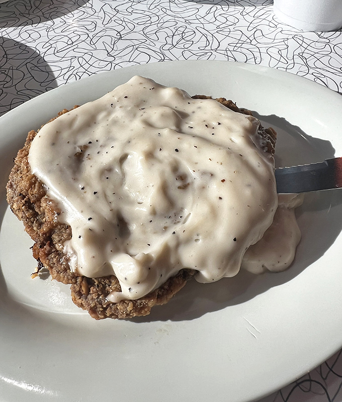 Country-fried steak swimming in pepper-flecked gravy &ndash; where "portion control" means you might need to control yourself from licking the plate.