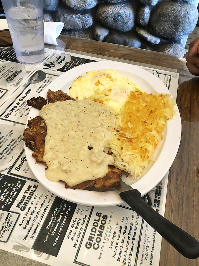 Country-fried steak smothered in peppery gravy alongside eggs and hash browns &ndash; the breakfast equivalent of winning the lottery without having to share.