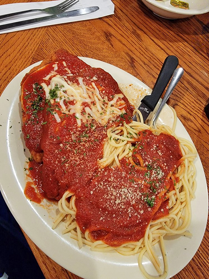 Chicken Parmesan done right: tender cutlets swimming in marinara sauce that would make your Italian grandmother weep.