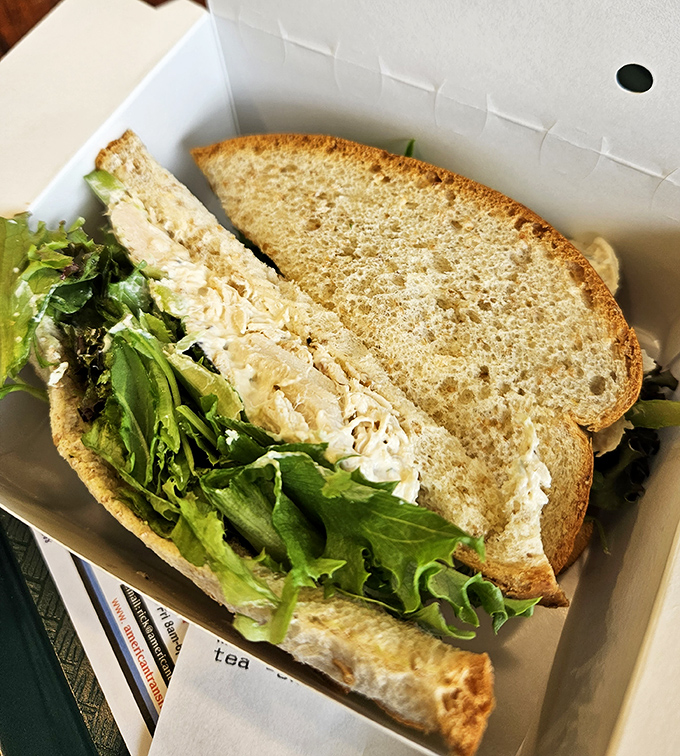 The chicken salad sandwich &ndash; where simplicity meets satisfaction. Fresh greens and hearty bread cradle a chicken salad that deserves its own fan club.