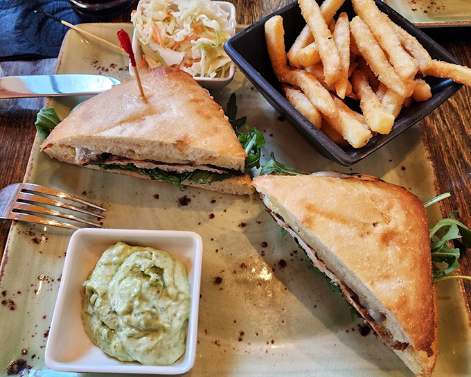 A sandwich that understands the assignment: crispy bread, fresh fillings, and sides that don't know they're supposed to be afterthoughts.