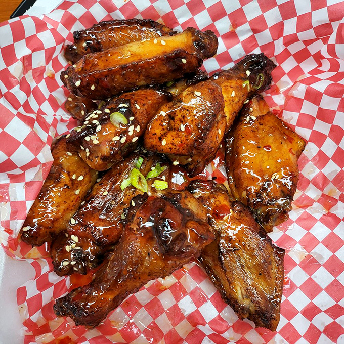 Wings that have clearly been introduced to smoke and sauce in the most intimate way possible. No first-date food, but worth every napkin.