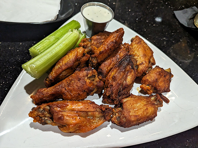 Wings that could make Buffalo jealous, served with celery sticks that provide the illusion of healthiness we all need.