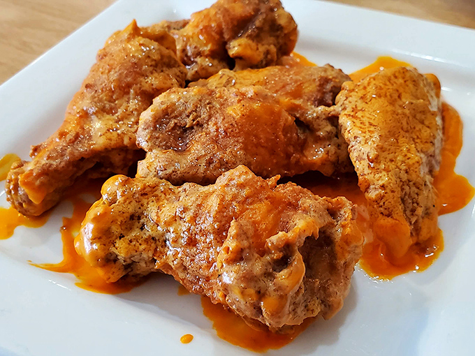 These wings aren't just crispy; they're the kind of golden-brown perfection that makes you temporarily forget table manners exist.