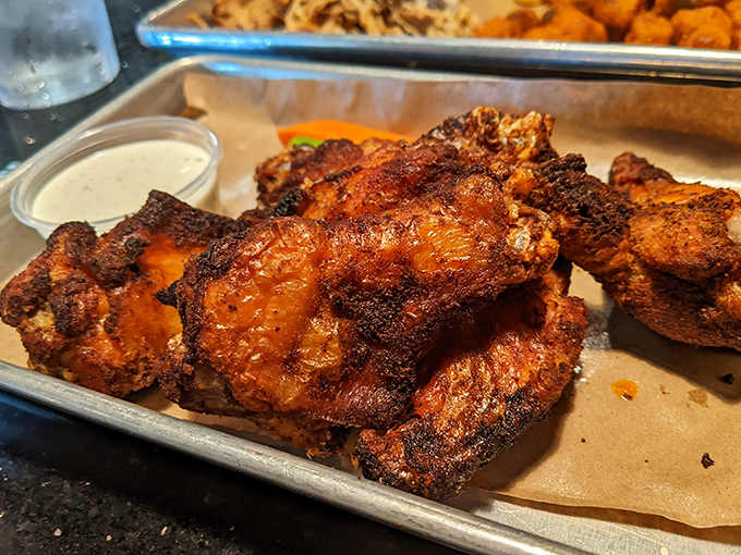 Wings with that perfect smoke ring and char that whisper, "Yes, we spent hours getting this exactly right just for you."