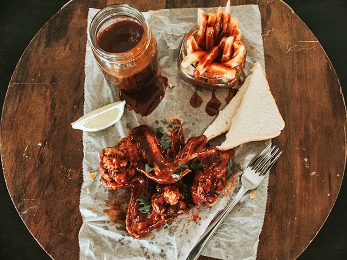 These wings have clearly been introduced to heat twice&mdash;once in the smoker and again with that glorious sauce that demands both napkins and respect.