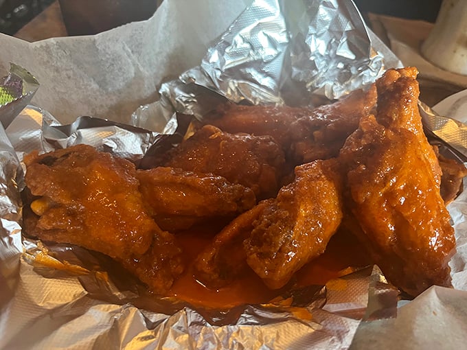 Wings that would make Buffalo proud. Glistening with sauce and nestled in foil&mdash;these aren't just appetizers, they're the reason napkins were invented.
