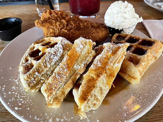 Chicken and waffles unite in delicious harmony, proving that breakfast and dinner can peacefully coexist on one plate.
