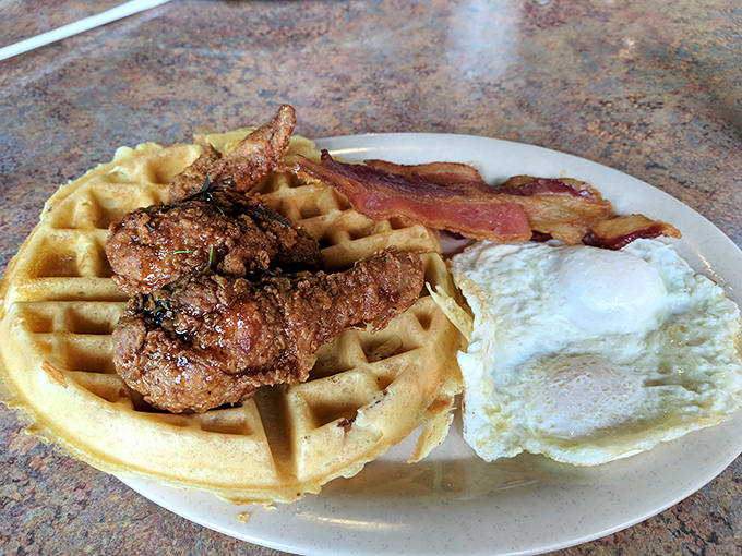 The breakfast holy trinity: golden waffle, crispy fried chicken, and perfectly cooked eggs. Name a more iconic trio&mdash;I'll wait.