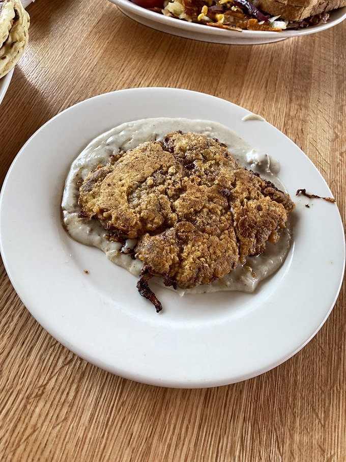 Chicken fried steak swimming in gravy—where Southern comfort food meets Pacific Northwest hunger in a beautiful culinary marriage.