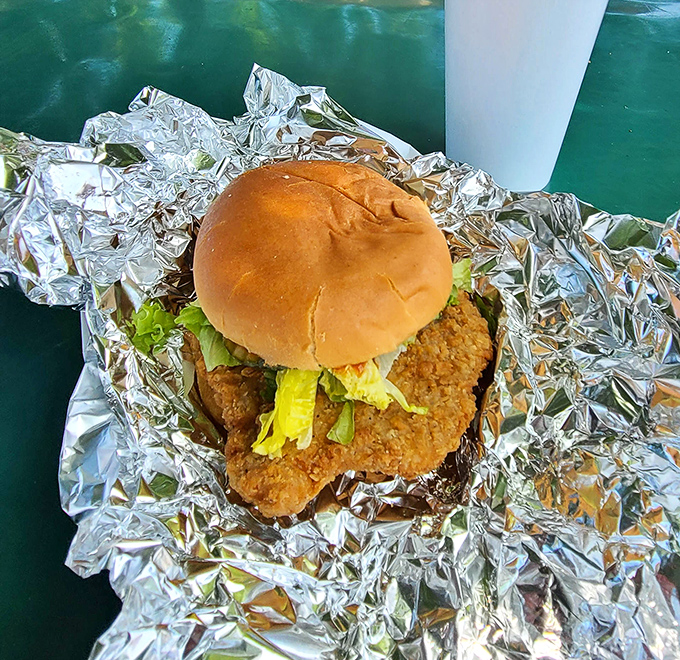 This chicken sandwich doesn't need fancy aioli or artisanal bread to make its statement &ndash; just honest crispiness and a bun that knows its supporting role.