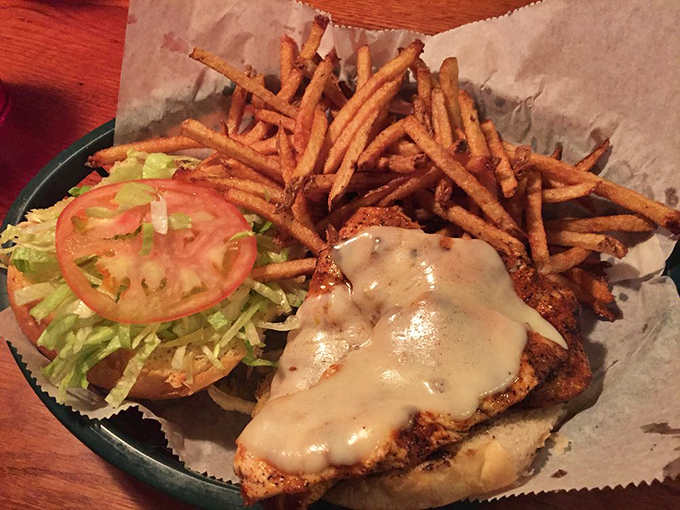 Chicken sandwiches are usually the boring option, but not here. This beauty, with its perfectly melted cheese and crispy fries, is anything but ordinary.