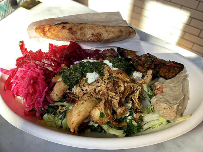 Chicken shawarma that would make your Mediterranean grandmother nod in approval&mdash;tender, aromatic, and nestled among a garden of fresh accompaniments.