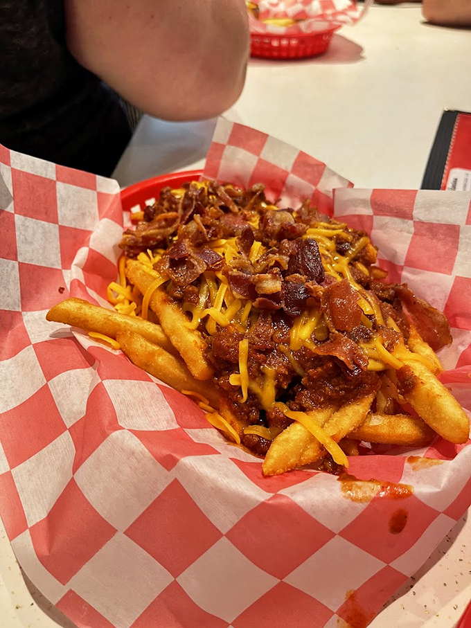 These loaded fries aren't just a side dish&mdash;they're a main event. Cheese, bacon, and chili creating a fork-required masterpiece that's worth every napkin.
