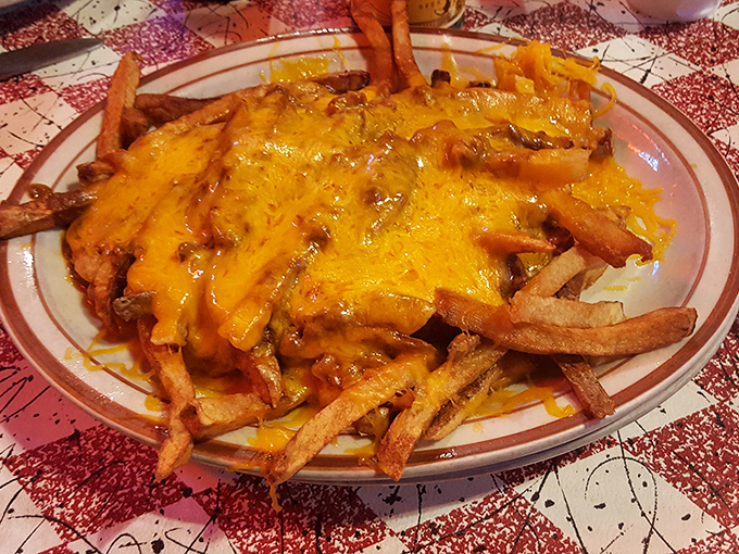 Chili cheese fries that don't apologize for their indulgence&mdash;hand-cut potatoes smothered in molten cheddar that stretches dramatically with each bite like a cheesy sunset.