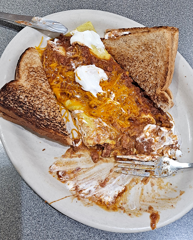 Breakfast gets the Cincinnati treatment with this glorious chili cheese omelet. Who says you can't start your day with a flavor explosion?