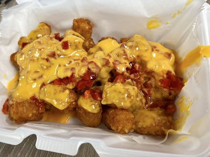 Tater tots elevated to art form: crispy nuggets of potato joy smothered in cheese and chili&mdash;comfort food that speaks directly to your soul.