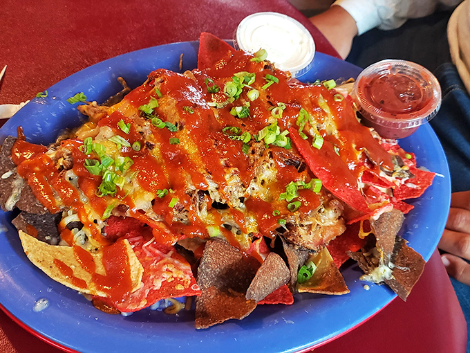 Nachos that require a strategy to eat. Every chip is a treasure map leading to pulled pork, cheese, and happiness.