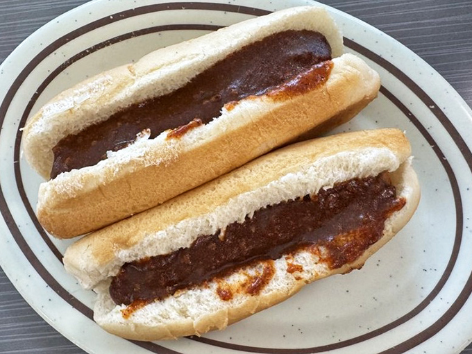 These chili dogs aren't just topped—they're smothered with love. The kind of messy relationship you'll never want to end.