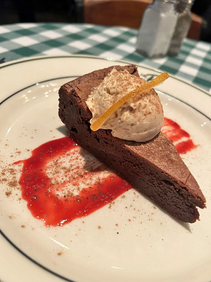 Chocolate cake that doesn't just satisfy your sweet tooth but throws a full-on party for it, complete with a raspberry sauce dance floor.