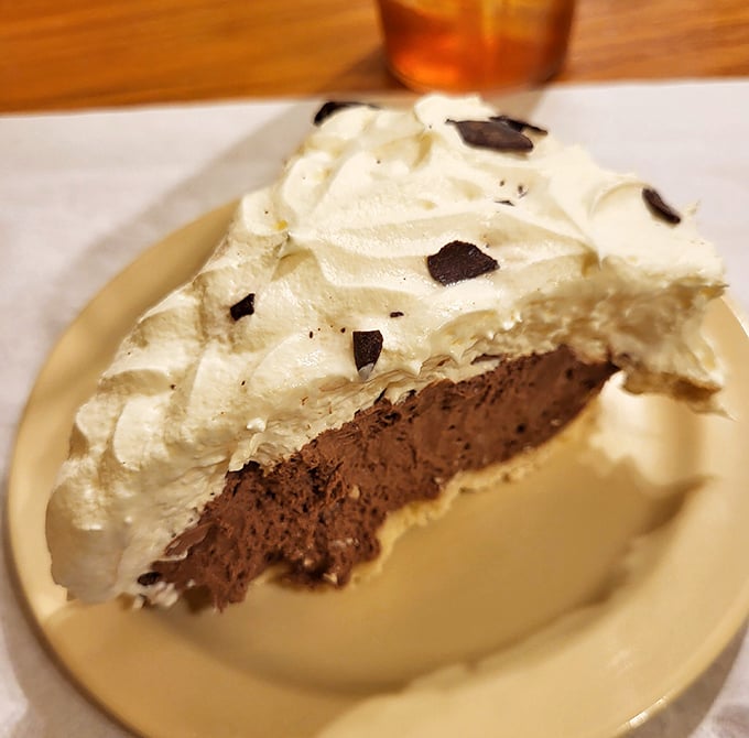 Chocolate cream pie with a cloud of whipped topping that makes you wonder why anyone bothers with fancy desserts when perfection is this simple.