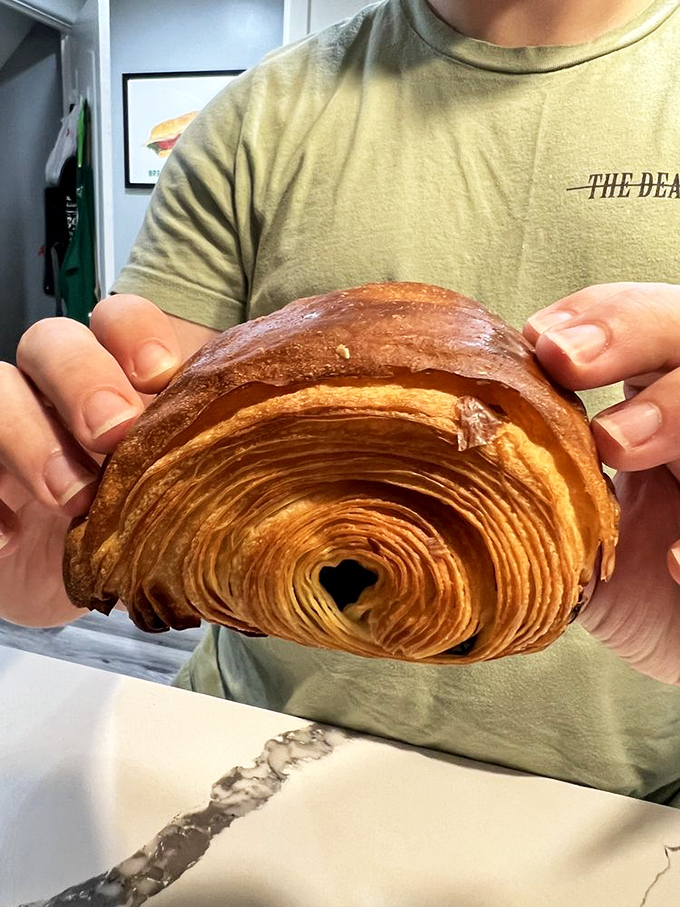 The holy grail of pastry craftsmanship&mdash;a croissant with hypnotic layers that spiral inward like the most delicious vortex you'll ever willingly fall into.
