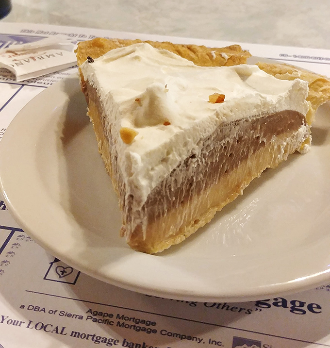 Layer upon layer of chocolate and cream create a pie that doesn't need social media filters—it's been Instagram-worthy since before Instagram existed.