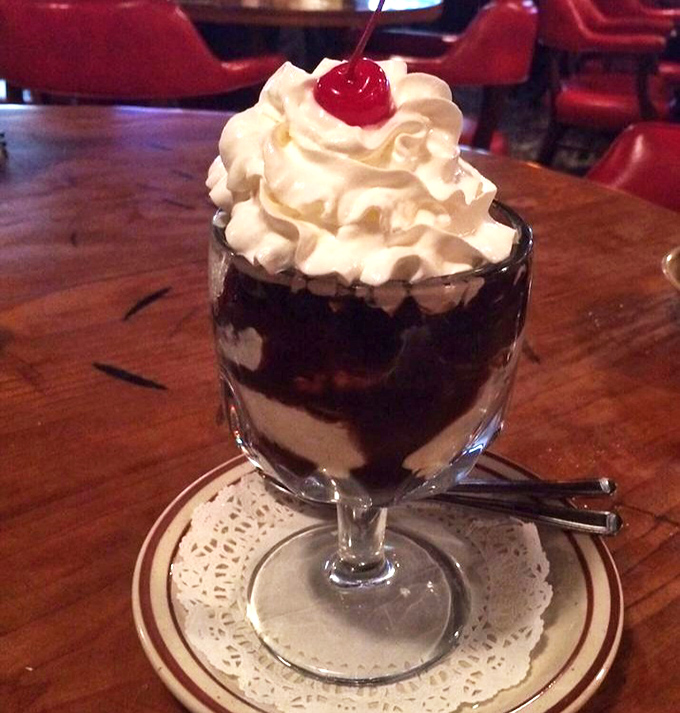 Dessert that defies restraint – a chocolate rum sundae topped with a cloud of whipped cream and that obligatory cherry you'll save for last.