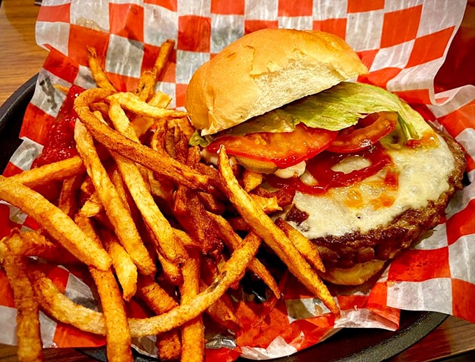 This isn't just a burger; it's a towering monument to American appetite. The kind of sandwich that requires strategic planning before the first magnificent bite.