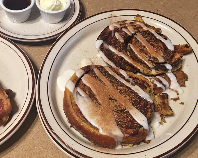 Cinnamon rolls drizzled with icing that would make even the most disciplined dieter whisper, "Worth it."