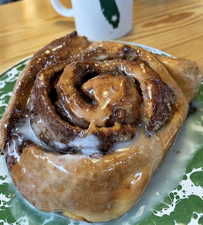 This cinnamon roll isn't playing around&mdash;it's the heavyweight champion of breakfast indulgence, glistening with enough glaze to make your dentist wince.