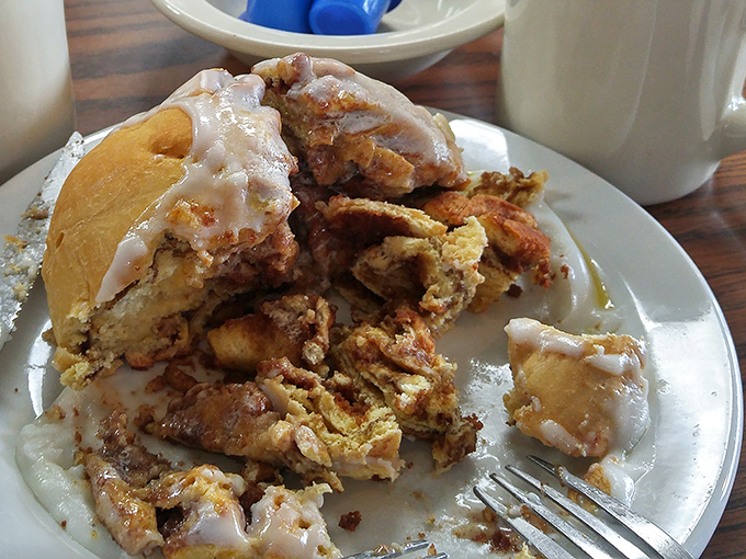 These cinnamon rolls aren't just breakfast, they're an architectural achievement that would make Frank Lloyd Wright put down his blueprints and pick up a fork.