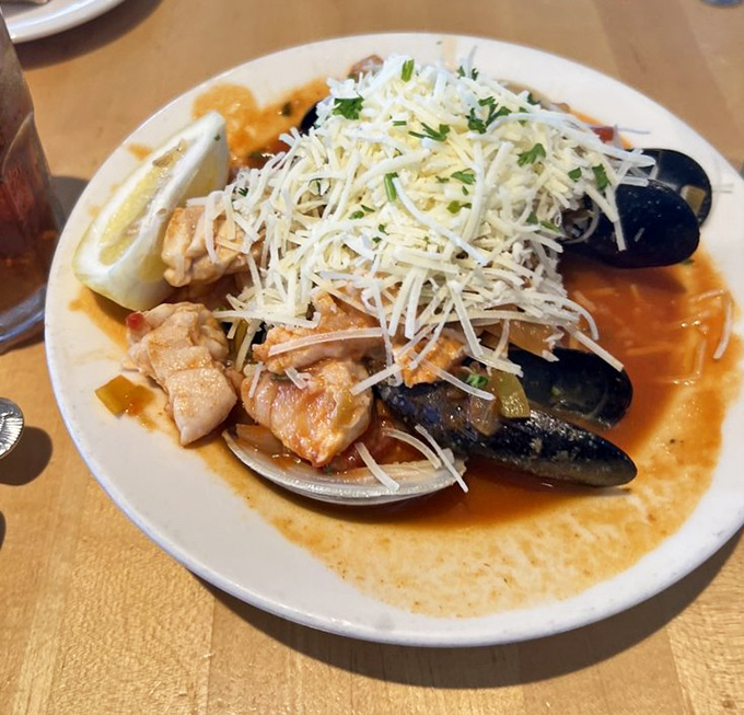 Ocean bounty in a single bowl. This cioppino doesn't just showcase seafood&mdash;it tells the story of the fishing boats you can see right outside the window.