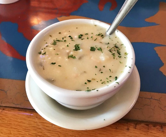 Creamy clam chowder that doesn't skimp on the main attraction &ndash; each spoonful delivers that perfect balance of briny ocean and velvety comfort.