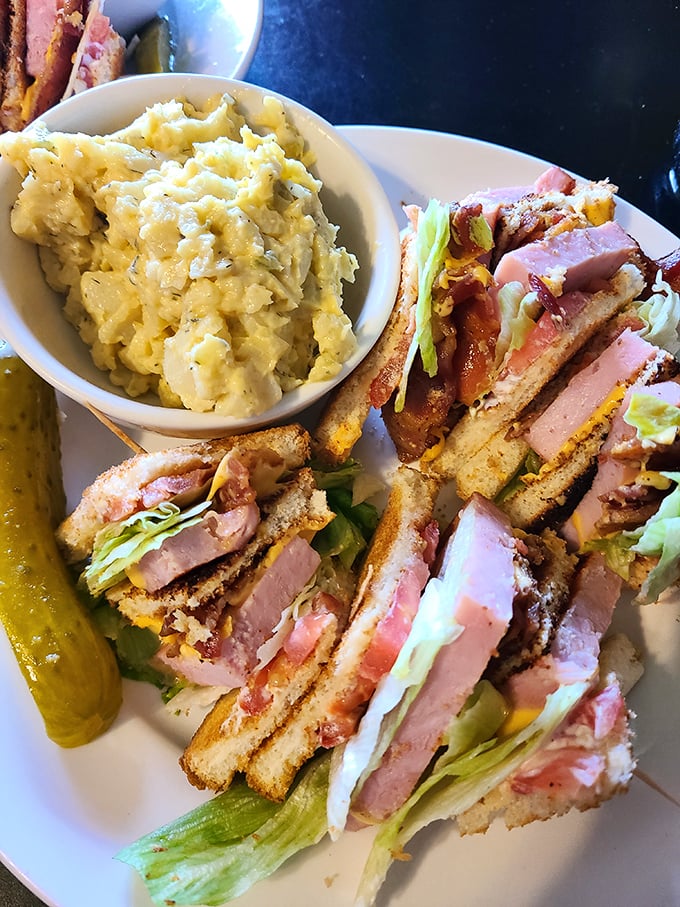 This club sandwich isn't playing around &ndash; it's a skyscraper of flavor with enough layers to make a geological survey team excited.