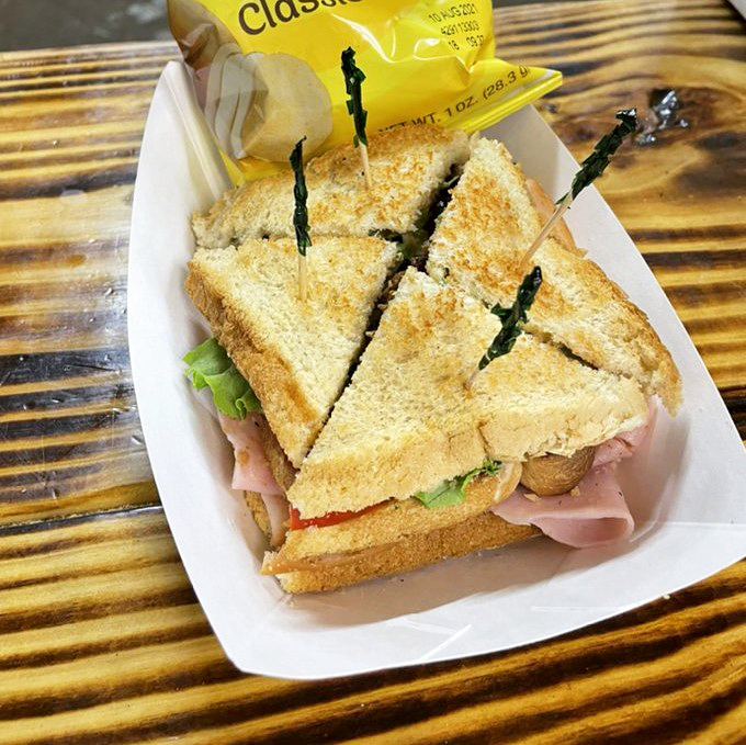 The club sandwich &ndash; architecture you can eat! Layers of ham, fresh veggies, and toasted bread create the kind of handheld masterpiece that makes road trips worthwhile.