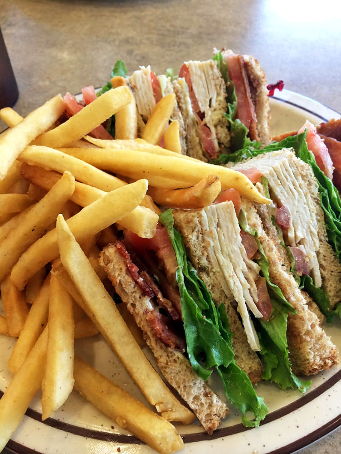 The club sandwich&mdash;architecture you can eat, where each layer tells its own delicious story between perfectly toasted bread.