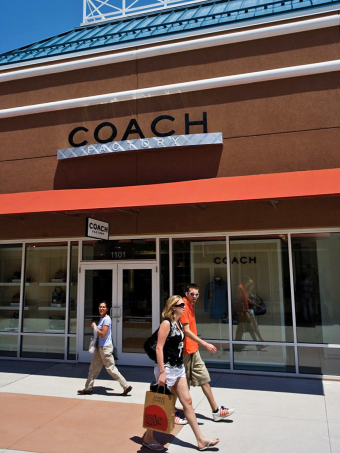 Coach: where leather dreams come true without the nightmare prices. Those shoppers emerging with their treasured orange bags know they've scored the ultimate retail touchdown. 