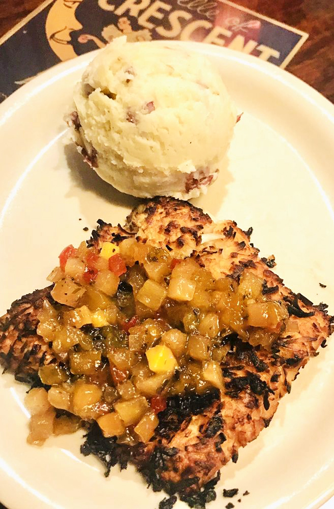 Coconut-crusted mahi-mahi with tropical salsa and a scoop of heaven&mdash;proof that sometimes the best vacation souvenirs are flavor memories.