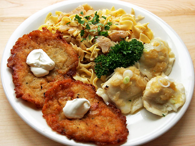 The potato pancake platter isn't just a meal&mdash;it's edible architecture: golden-brown pancakes, buttery noodles, and pierogi forming a carb-lover's dream team.