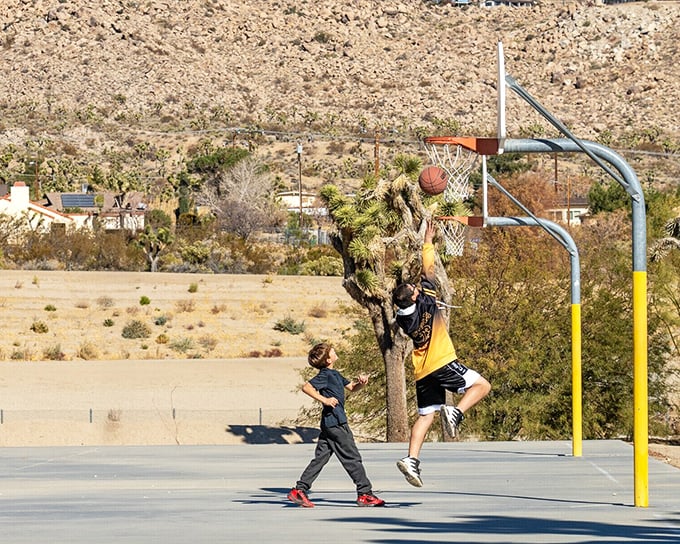Pickup games with a view! Local kids shoot hoops against a backdrop that looks like it was painted by Georgia O'Keeffe &ndash; everyday life with extraordinary scenery.