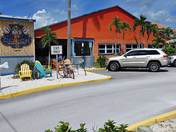 The Conch Republic's vibrant orange exterior is like a sunset you can visit at noon. Beach dining with a side of Florida flamboyance.